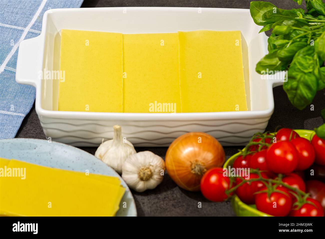 Woman preparing meat lasagna in kitchen. lasagna recipe - Italian food ...