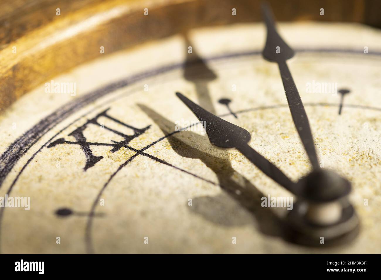 time concept through the hands of an old clock Stock Photo - Alamy