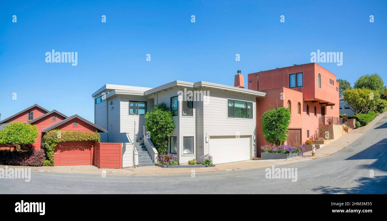 Three houses at the bottom of an uphill road in San Francisco ...