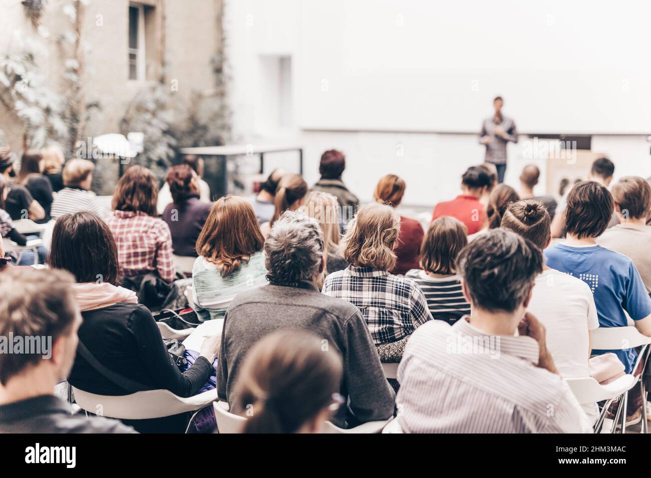 Man giving presentation in lecture hall at university Stock Photo - Alamy