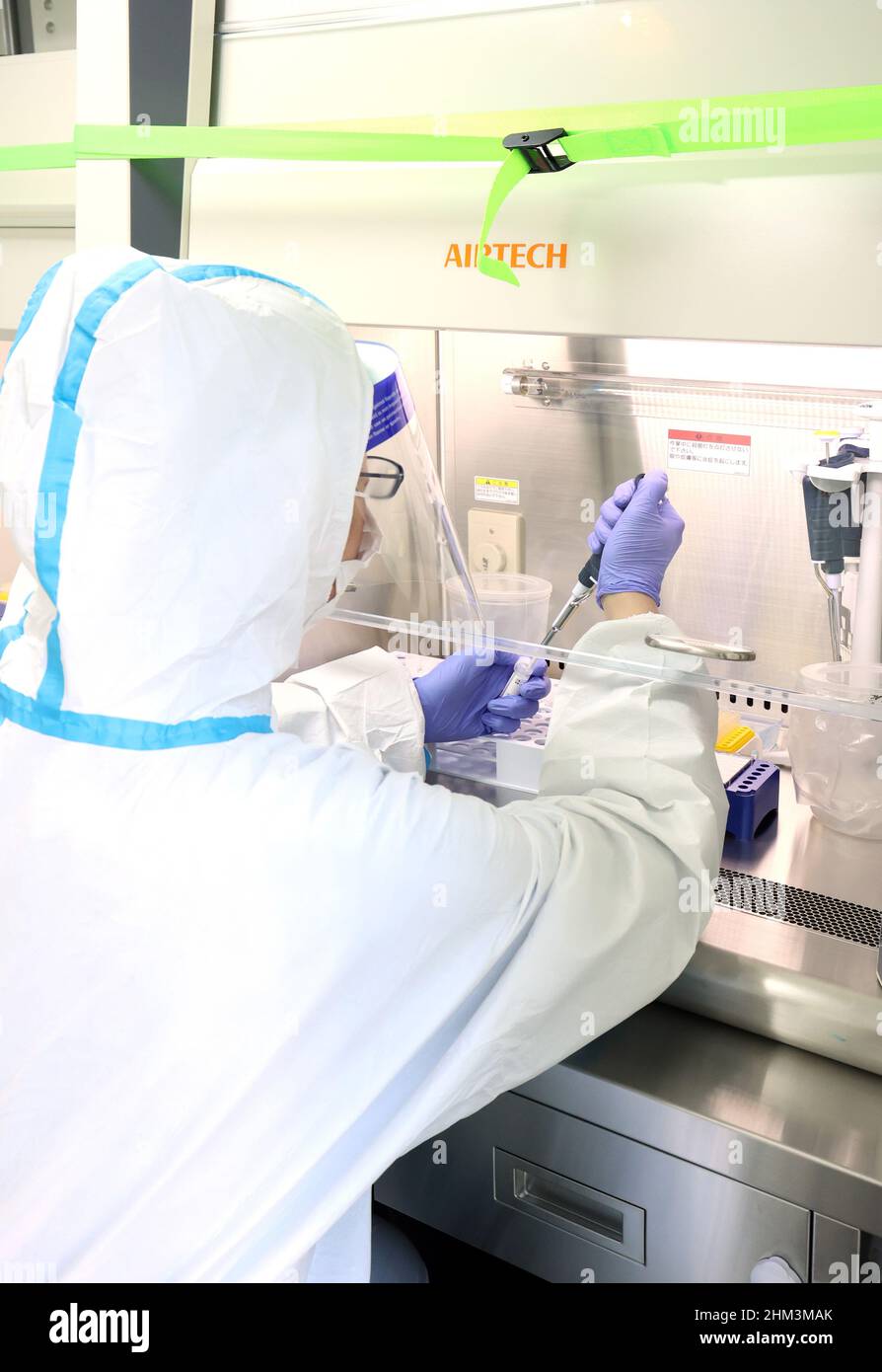 Tokyo, Japan. 7th Feb, 2022. A laboratory technician demonstrates ...