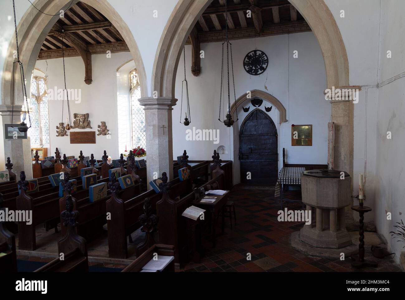 Stone baptismal font, sexton's wheel mounted about door, Yaxley church ...