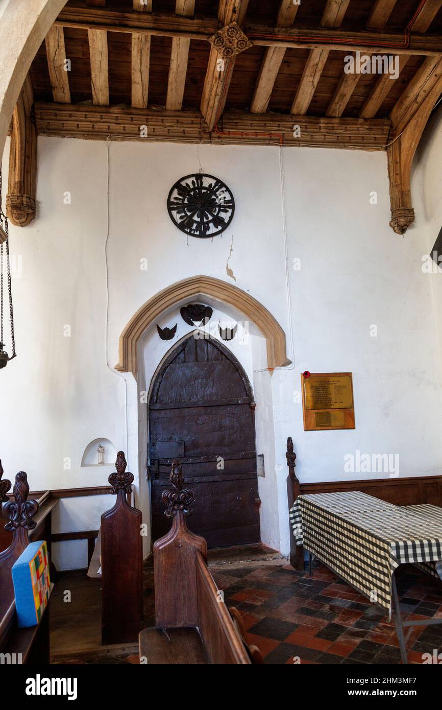 Sexton's wheel mounted about door, Yaxley church, Suffolk, England, UK ...