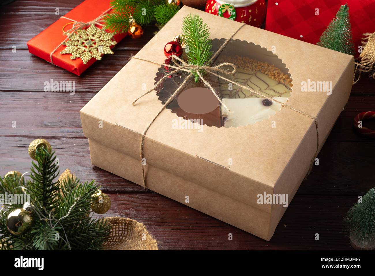 Set of different cakes in a craft box on brown wooden background Stock ...