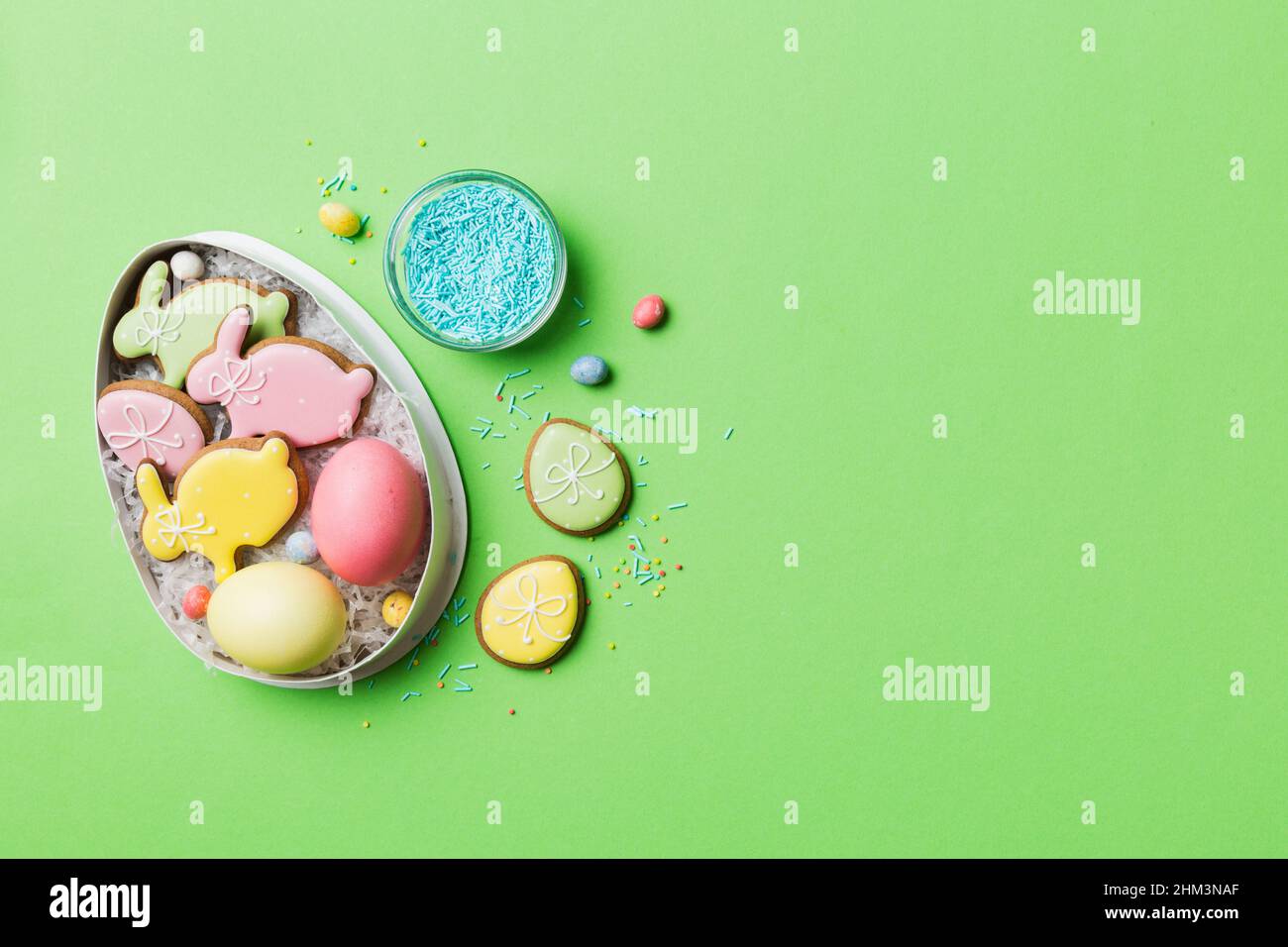 Colorful easter cookies in basket with Multi colors Easter eggs on ...