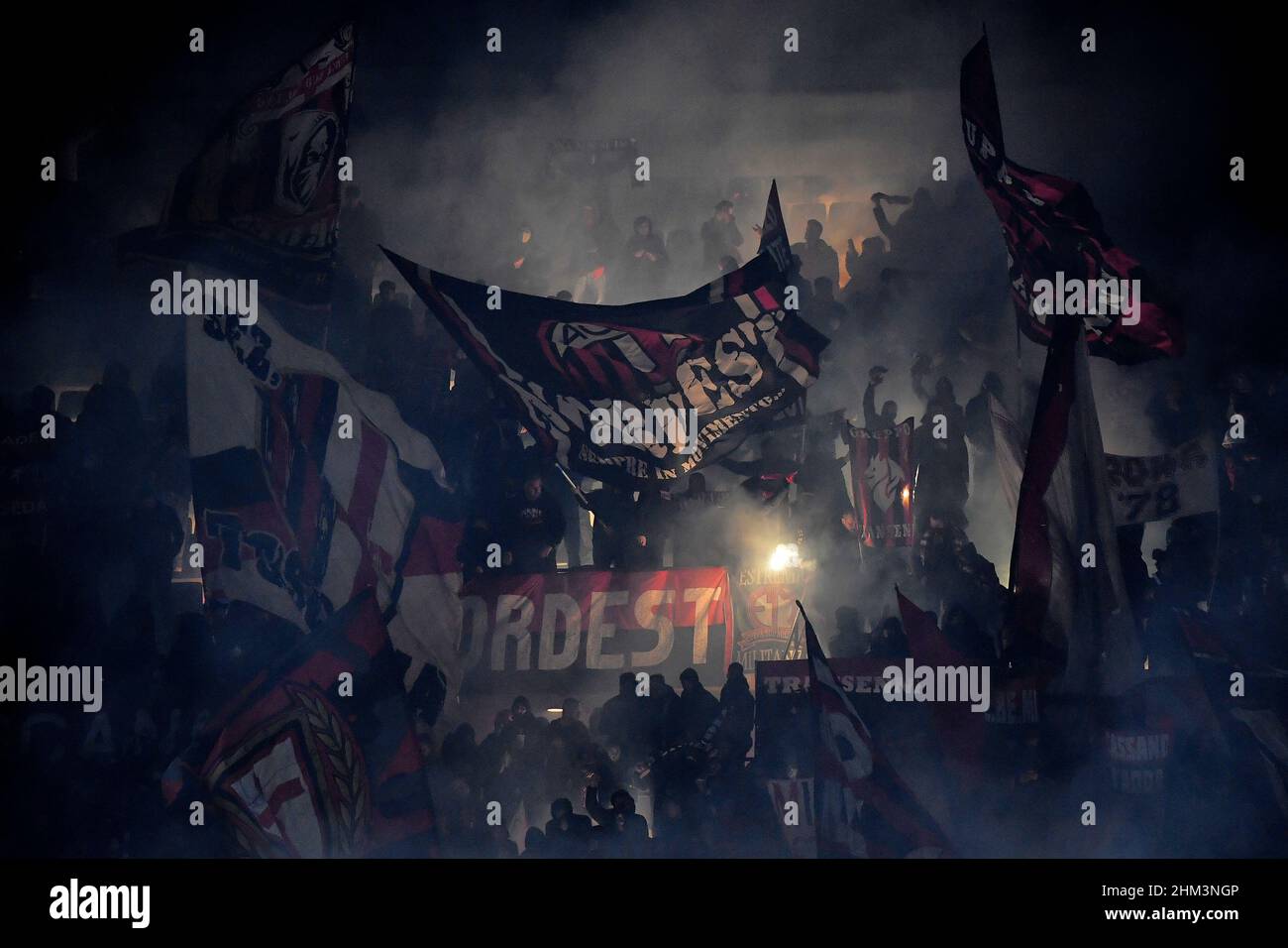Fans in the san siro stadium in milano with flares hi-res stock ...