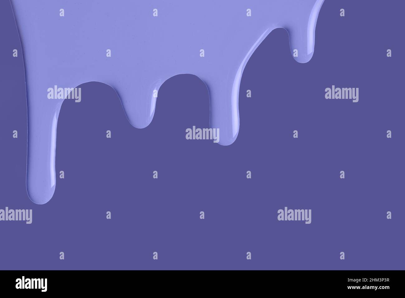 Light blue liquid drops of paint color flow down on isolated very peri ...