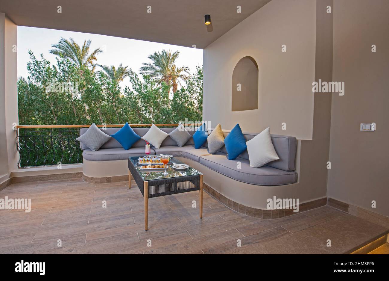 Patio terrace area at luxury tropical hotel resort room with sofa ...