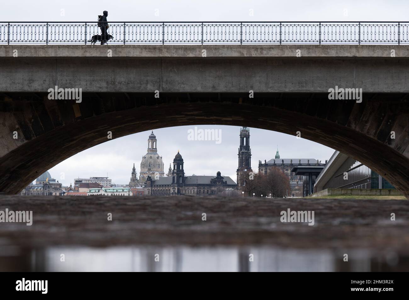 Dresden, Germany. 07th Feb, 2022. A passerby crosses the Marienbrücke ...