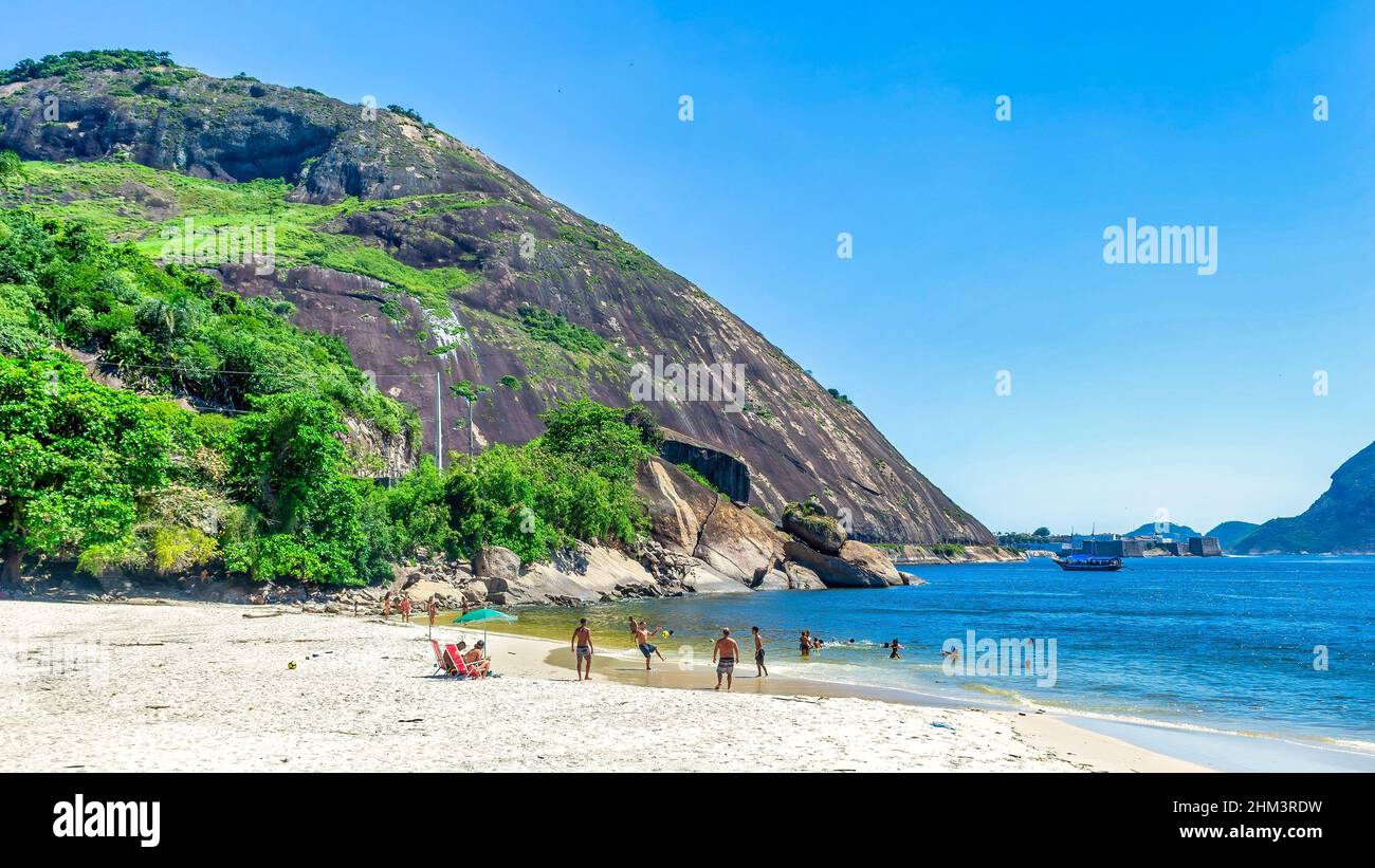Mountain side in the Praia Eva. People enjoying the Summer outdoors ...
