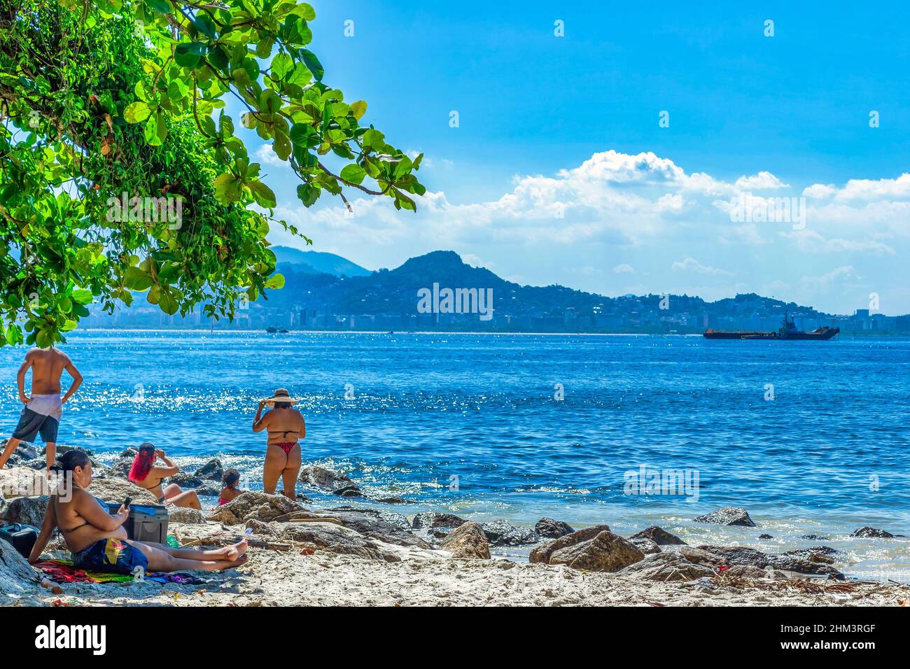People enjoying the Summer in the Praia de Eva. The Eva Beach in ...