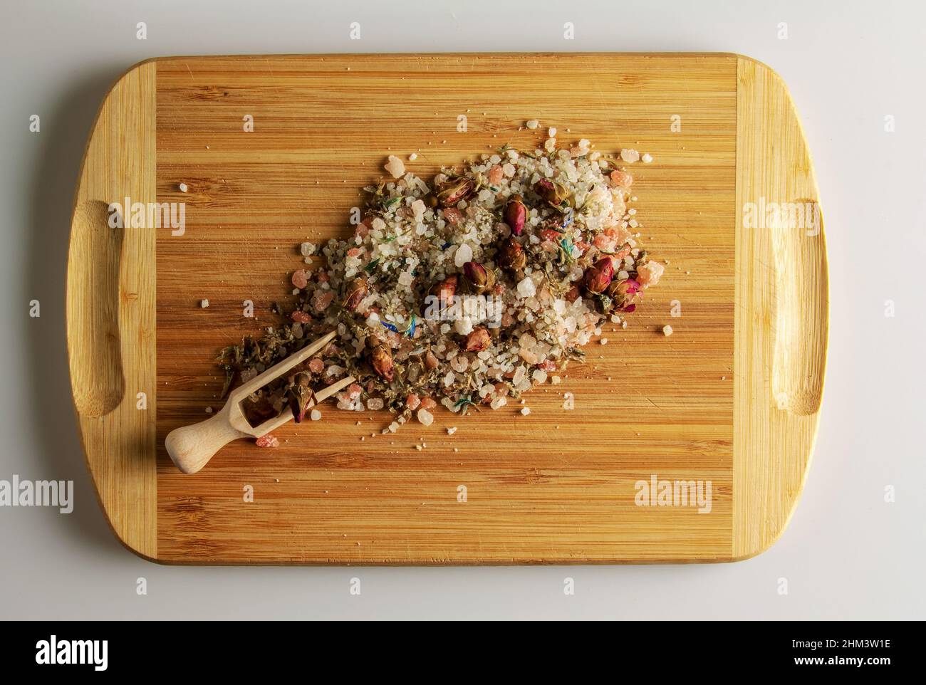 Bath salt with dried lavender and rose flowers. Salt background for spa ...