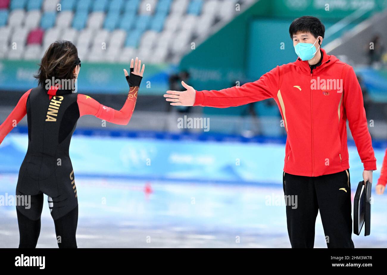 Beijing, China. 7th Feb, 2022. Ahenaer Adake (L) of China exchanges a ...