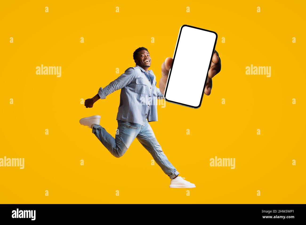 Brand new smartphone with blank screen in jumping guy hand Stock Photo ...