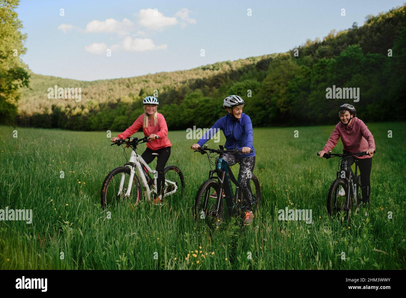 Three friends cycling hi-res stock photography and images - Alamy