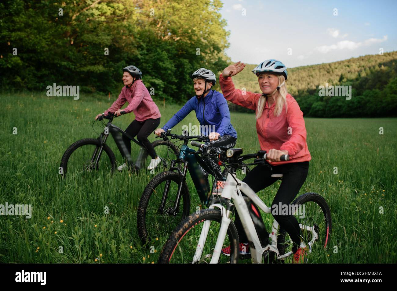 Three friends cycling hi-res stock photography and images - Alamy