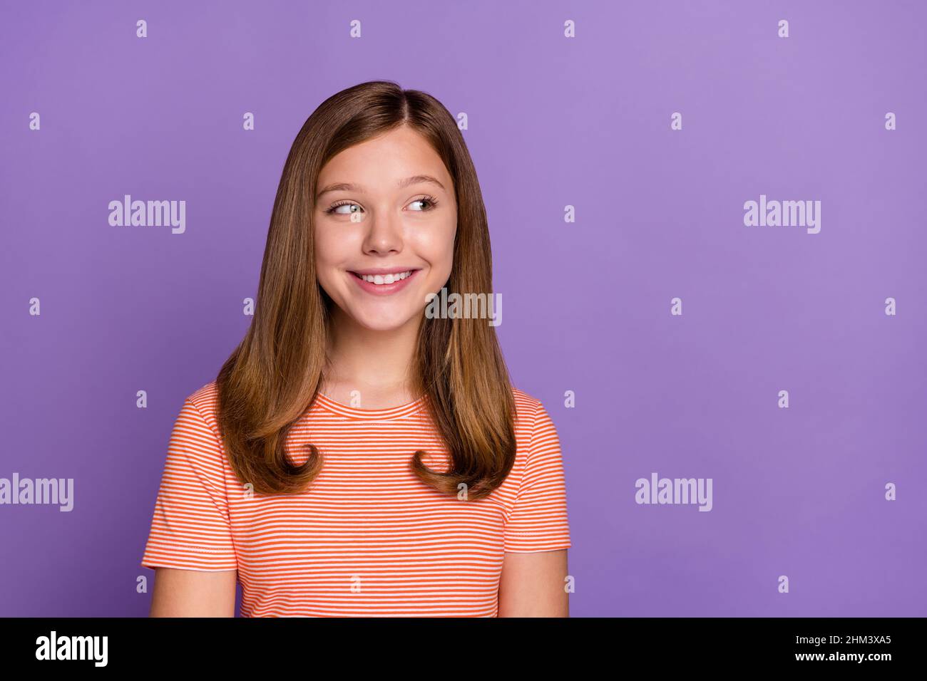 Portrait of attractive cheerful minded brown-haired girl thinking copy ...