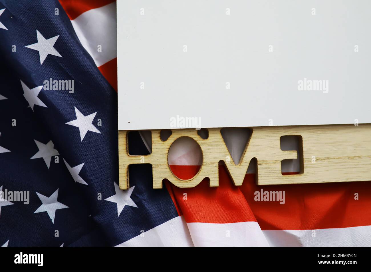 House symbol on American flag. Mortgage credit lending. Housing safety ...