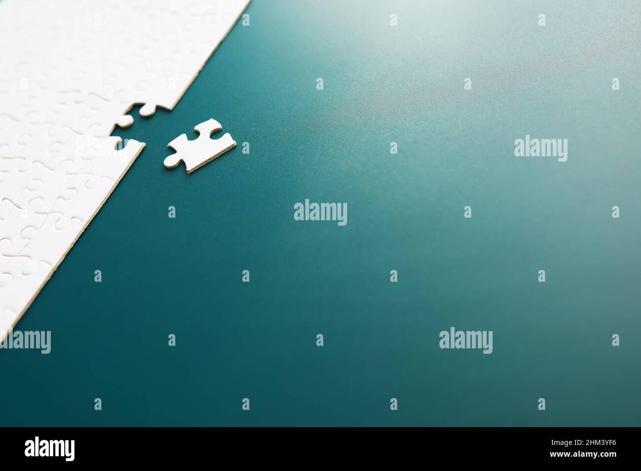 Intellectual puzzles. The puzzle empty. The hand puts together puzzle ...