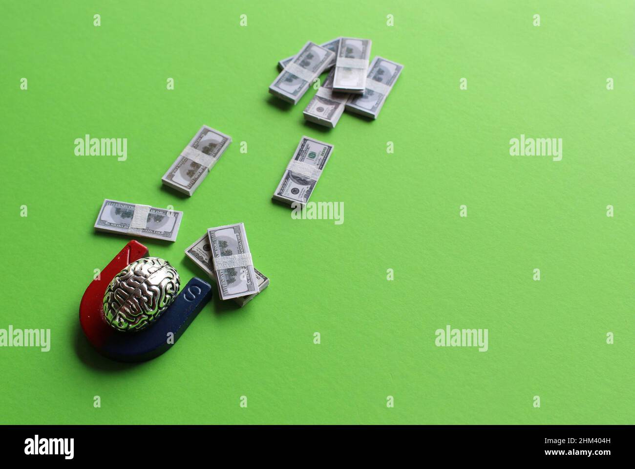 Business mindset, capitalism concept. Brain and magnet attract money on ...
