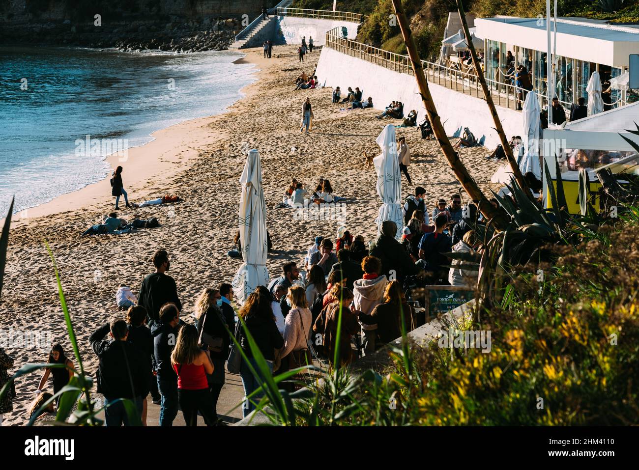 Parede, Cascais, Portugal - February 5, 2022: People enjoy a warm ...