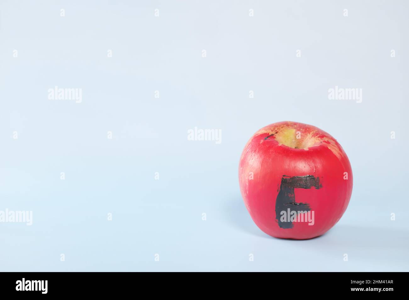 Fake food, coloring, fraud and fraudulent food concept. Apple painted ...