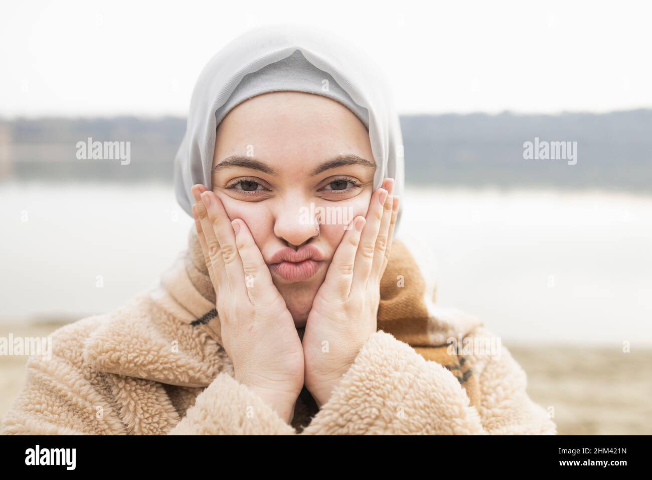 A woman jokingly making funny faces and fooling around Stock Photo - Alamy