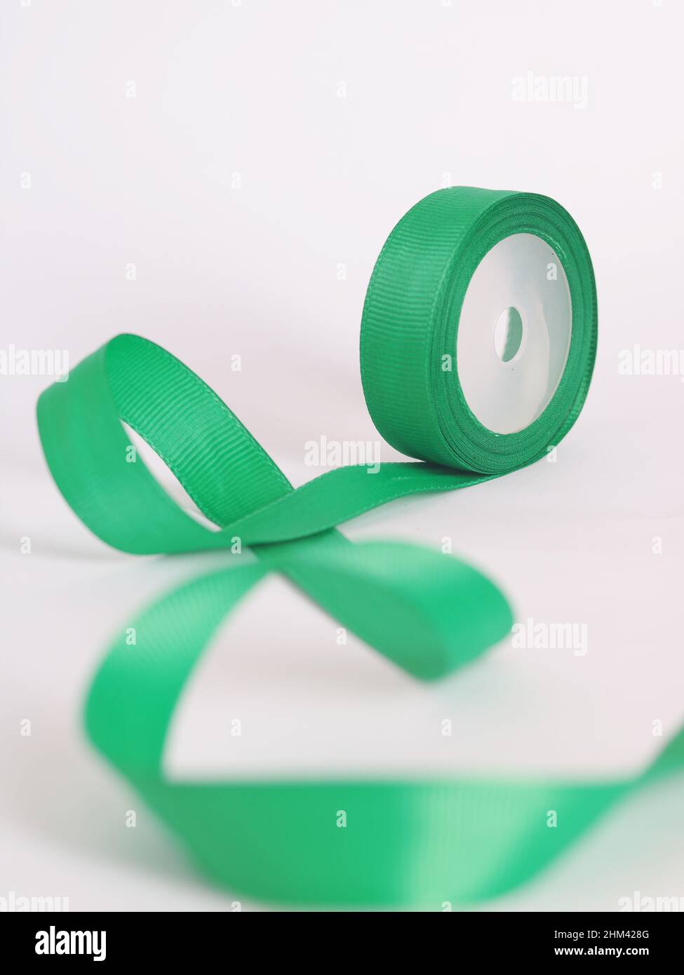 roll of green gift ribbon Stock Photo - Alamy