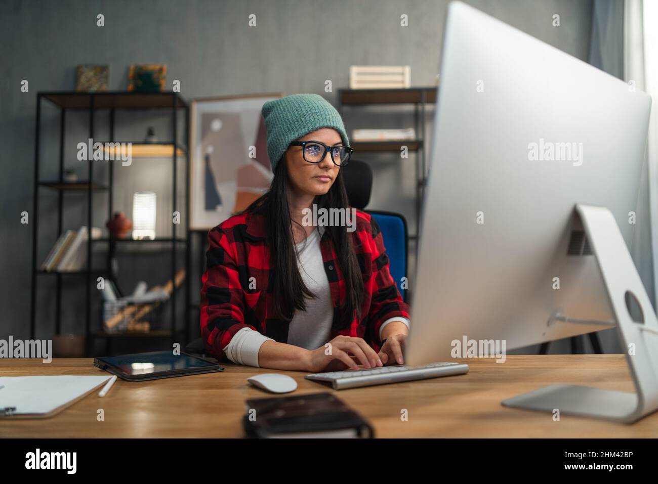 Female video editor works indoors in creative office studio Stock Photo ...