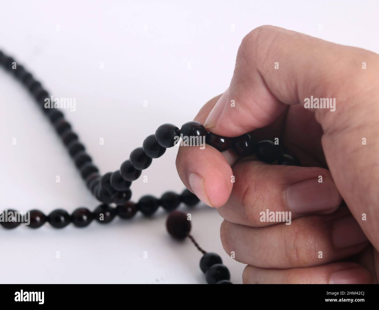 Symbolic Muslim pray with tasbih Stock Photo - Alamy