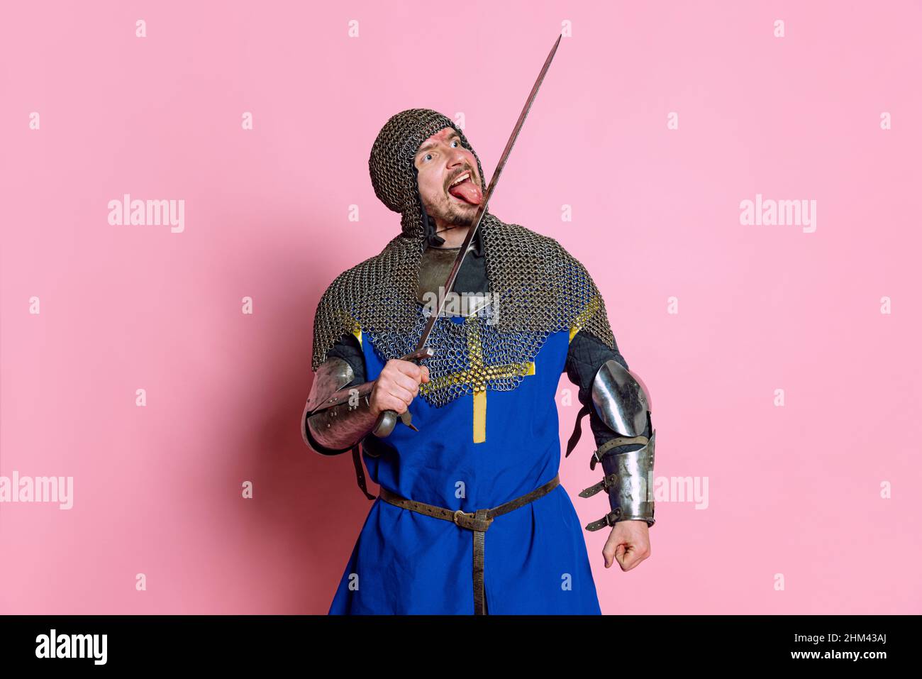 Portrait of man, medieval warrior or knight in armor with sword ...
