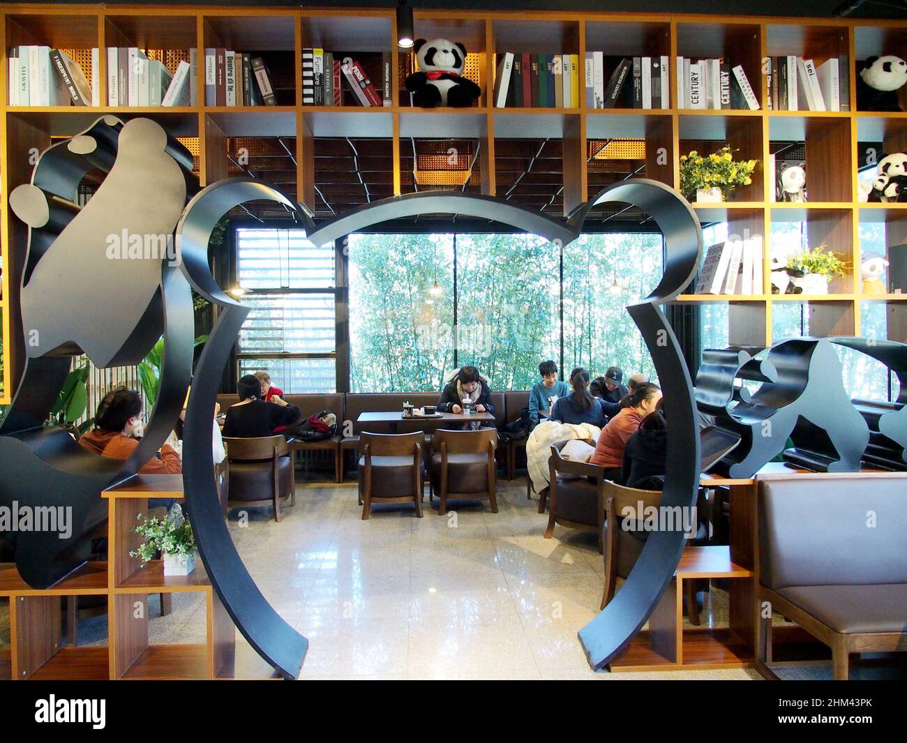 BEIJING, CHINA - FEBRUARY 7, 2022 - Visitors drink coffee at the Panda ...
