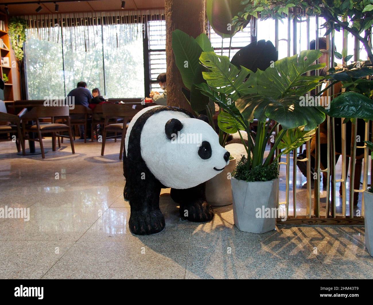 BEIJING, CHINA - FEBRUARY 7, 2022 - Visitors drink coffee at the Panda ...