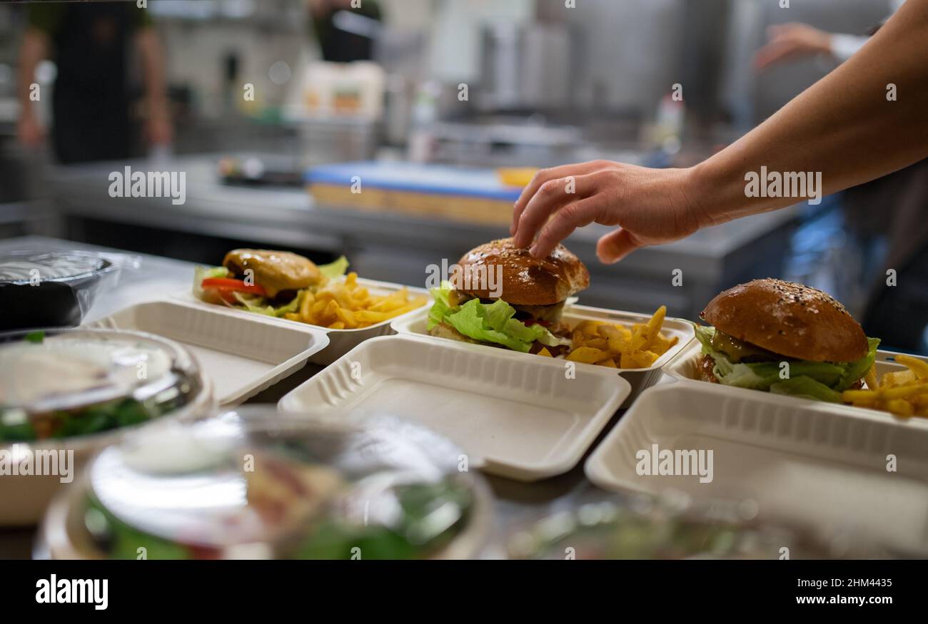Meals in containers prepared for take away in kitchen restaurant Stock ...