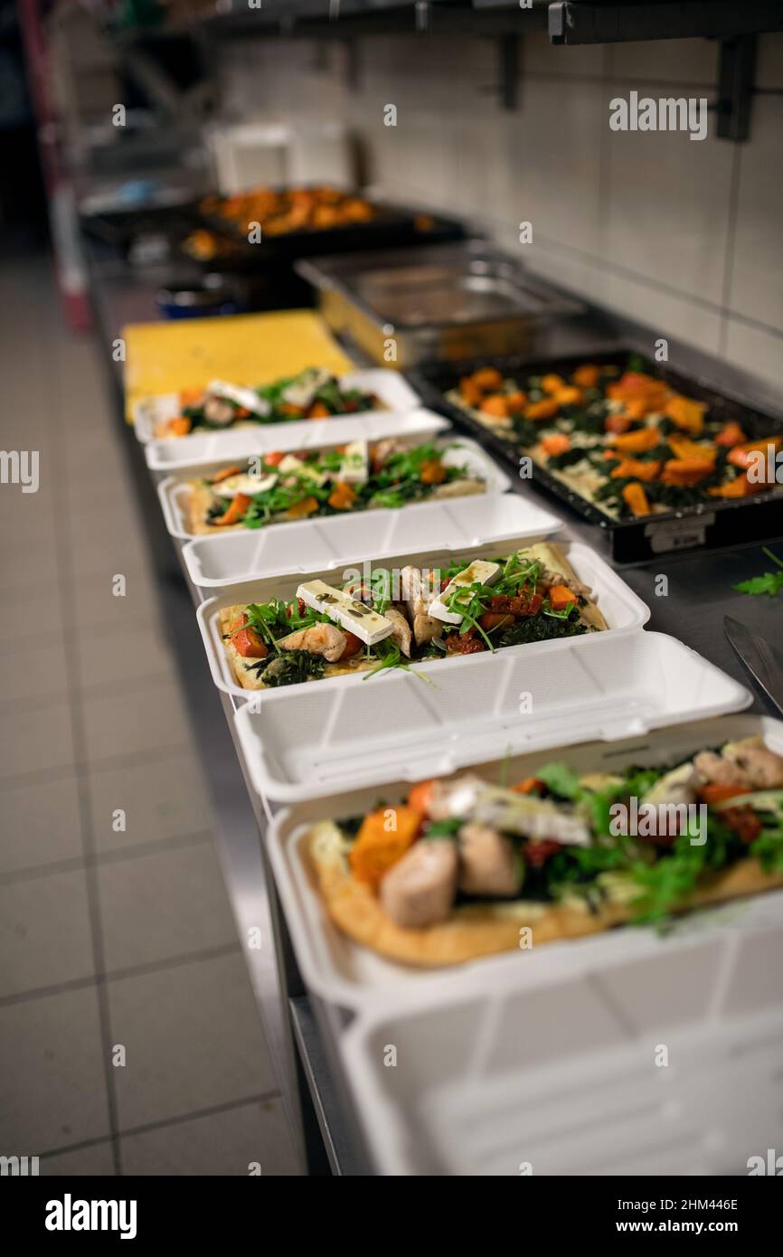 Meals in containers prepared for take away in kitchen restaurant Stock ...