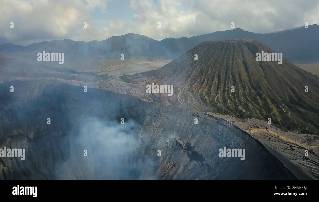View from above, stunning aerial view of the Mount Bromo with clouds of ...