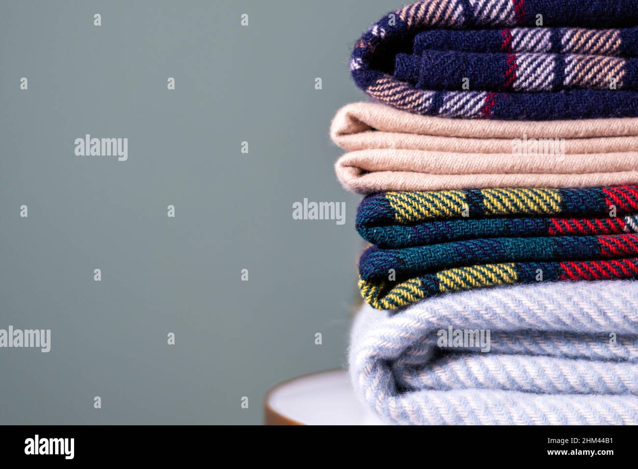 Stack of woolen checked blankets Stock Photo - Alamy