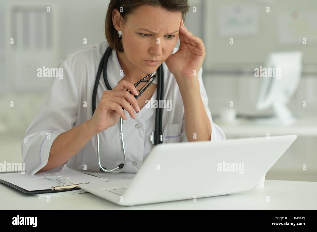 Portrait of sad female doctor in hospital Stock Photo - Alamy