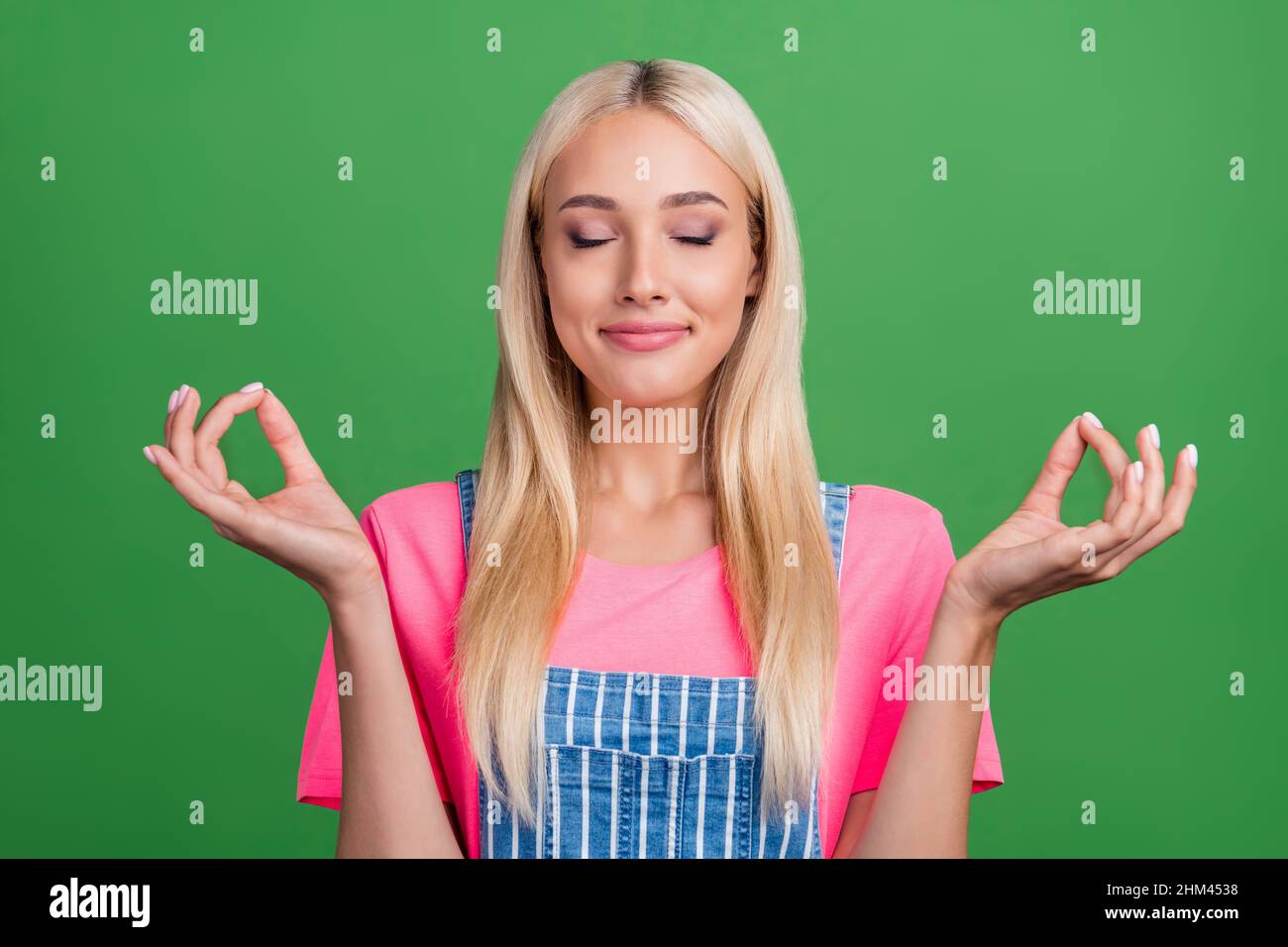 Photo of calm peaceful stress free lady enjoy meditation close eyes ...