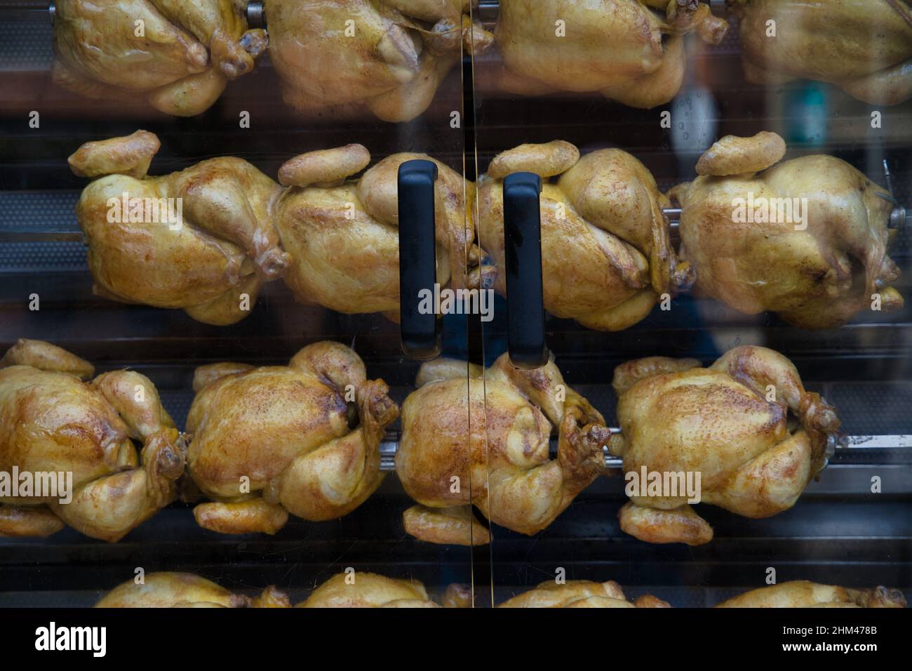 rotary machine grilled chicken Stock Photo - Alamy