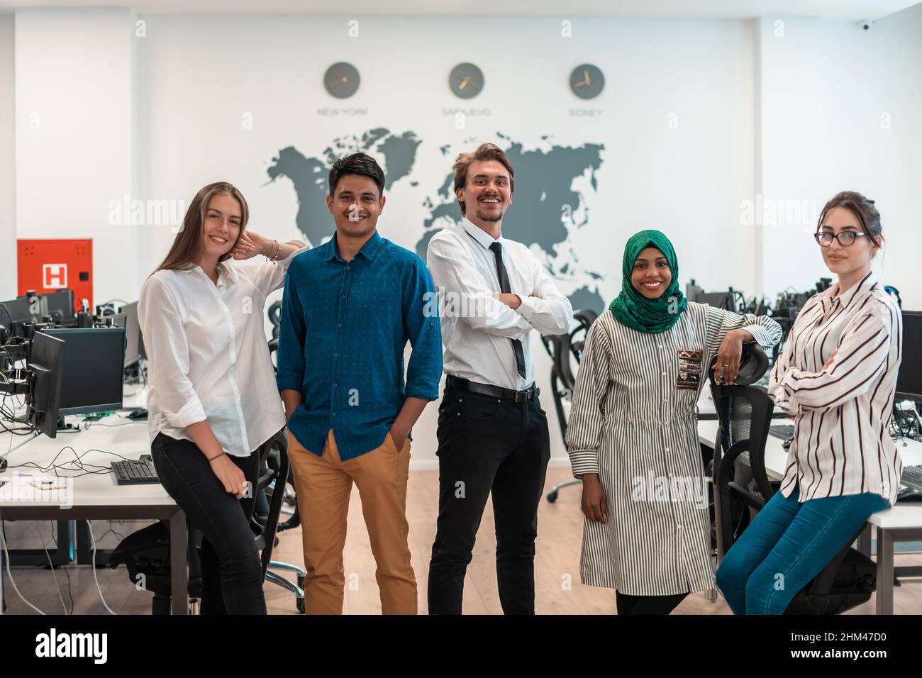 Portrait of young excited multiethnics business team of software ...