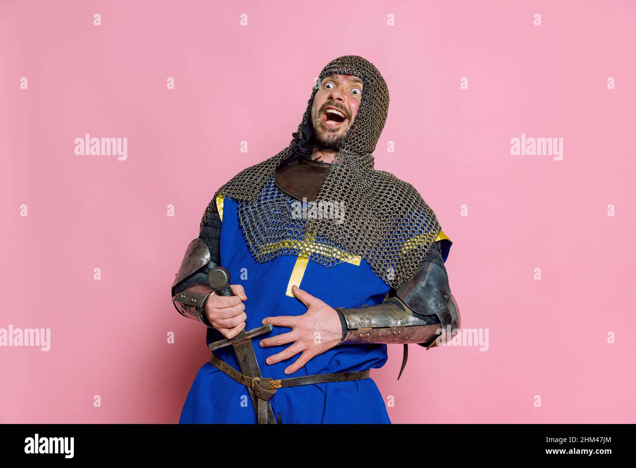 Portrait of man, medieval warrior or knight in special armor with sword ...