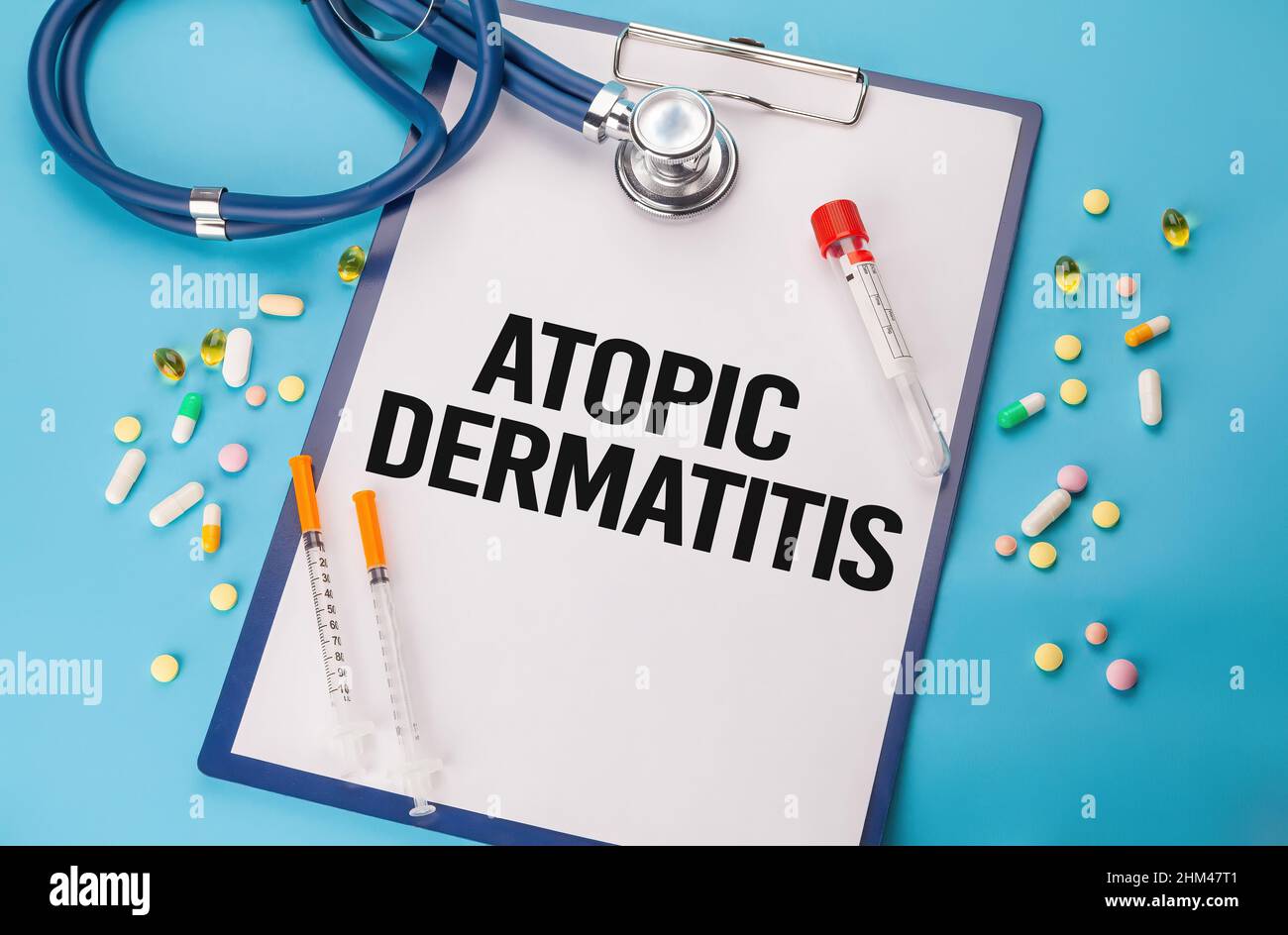 Tablet with the diagnosis Atopic Dermatitis. Stethoscope, paper with ...