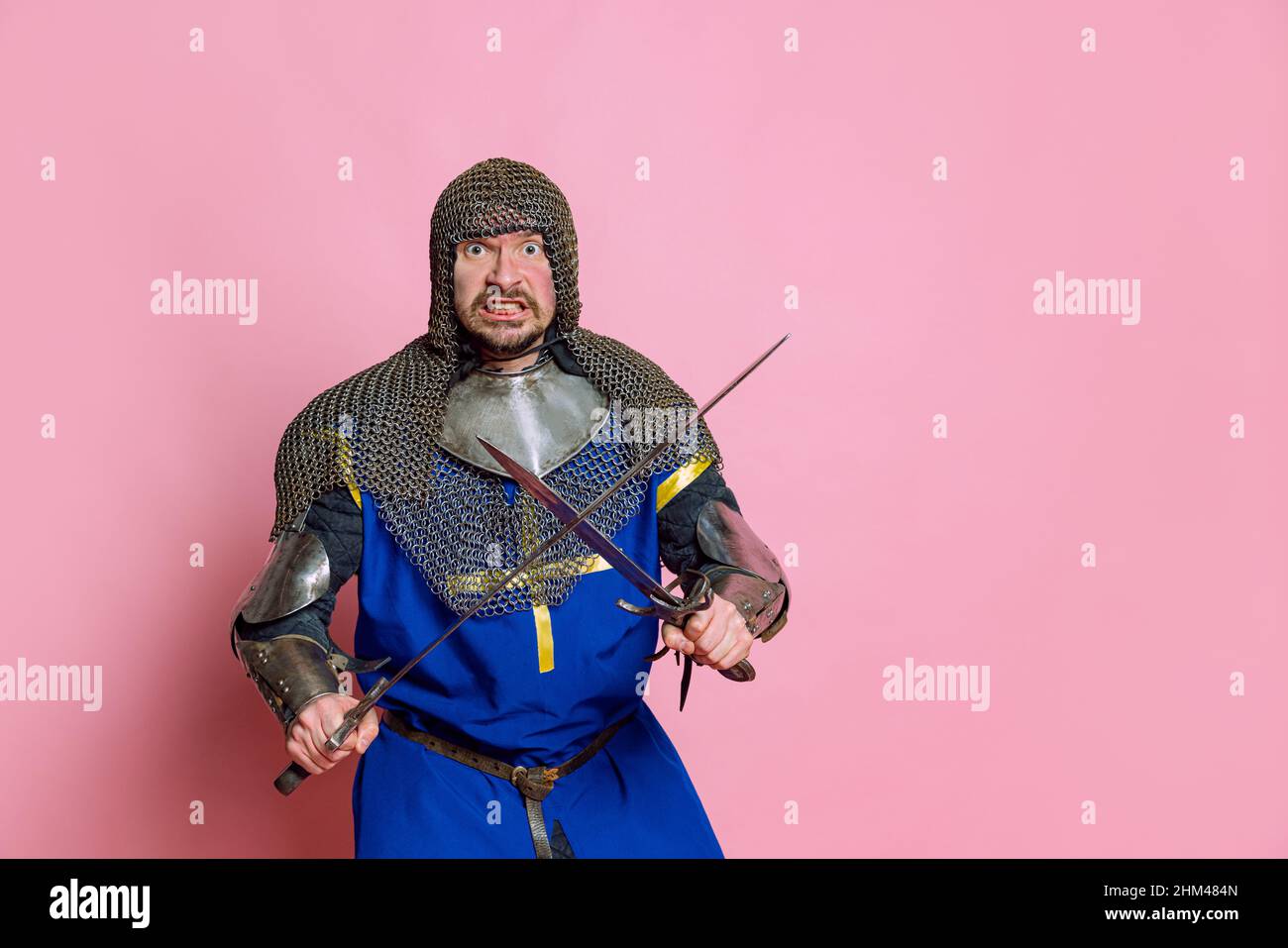 Portrait of angry man, medieval warrior or knight in special armor ...
