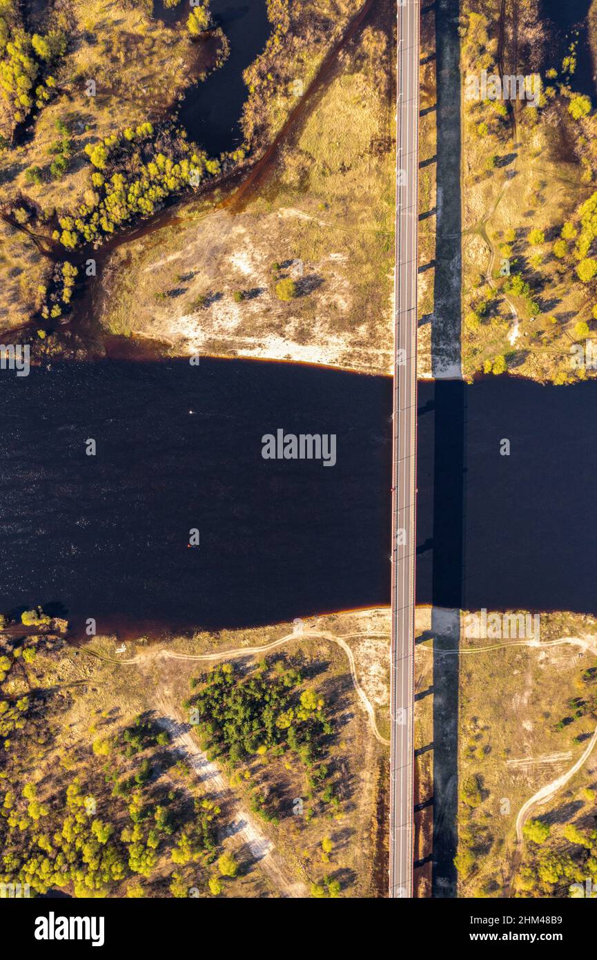 Bridge across Pripyat river in spring from above. Highway bridge across ...