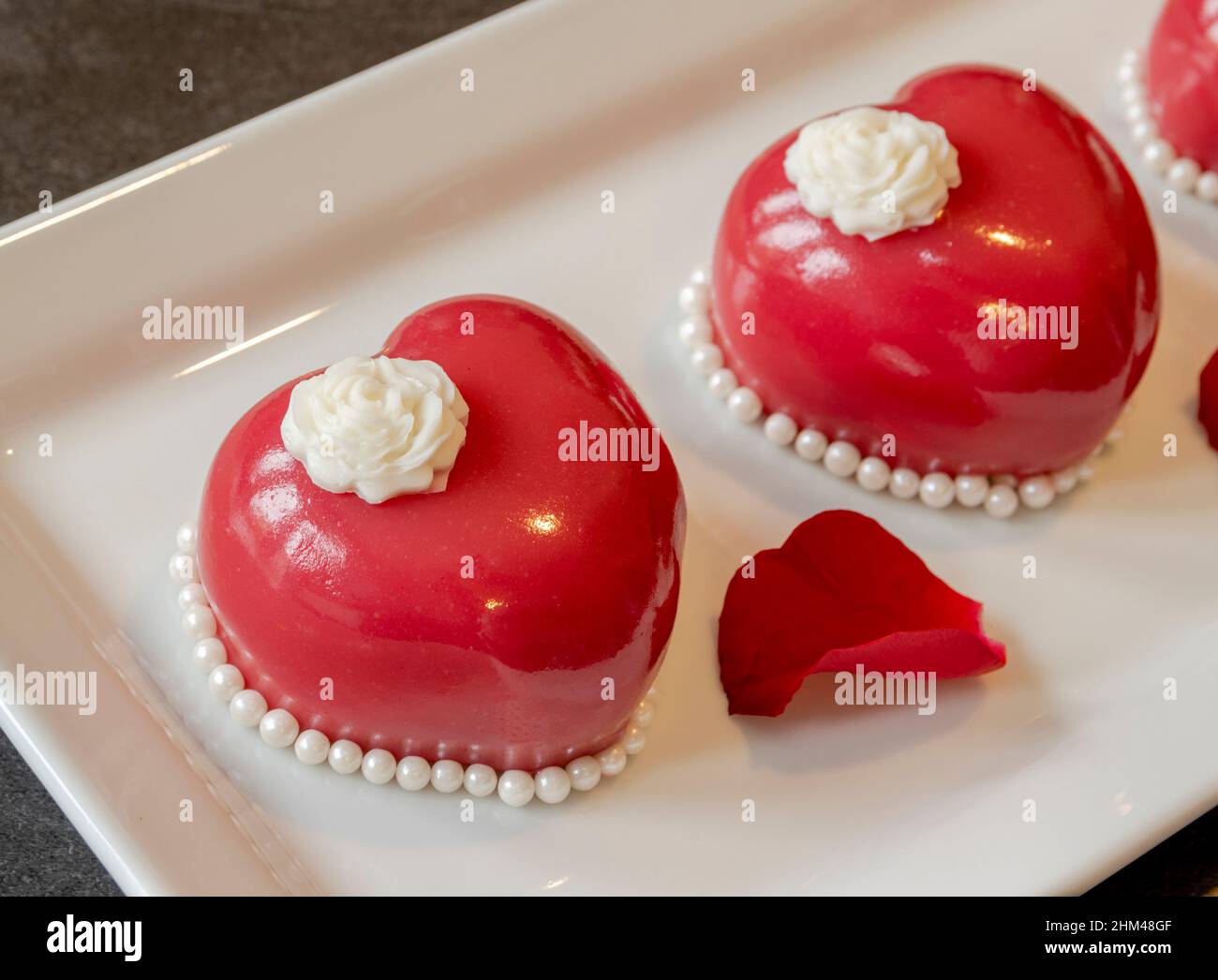Valentines Day Heart Entremets, Red glossy glazed heart puddings, with ...