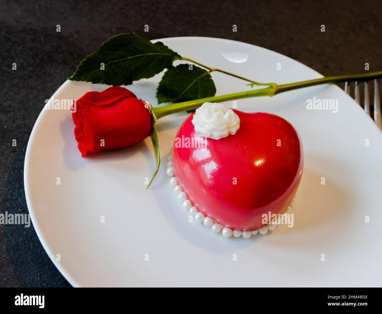 Valentines Day Heart Entremets, Red glossy glazed heart puddings, with ...