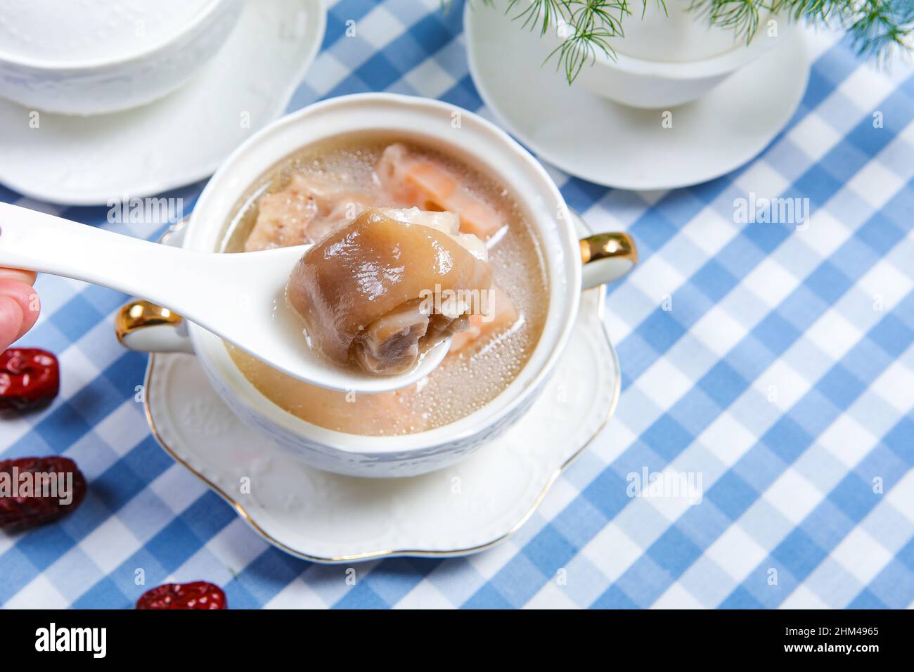 Lotus root pig feet soup Stock Photo - Alamy