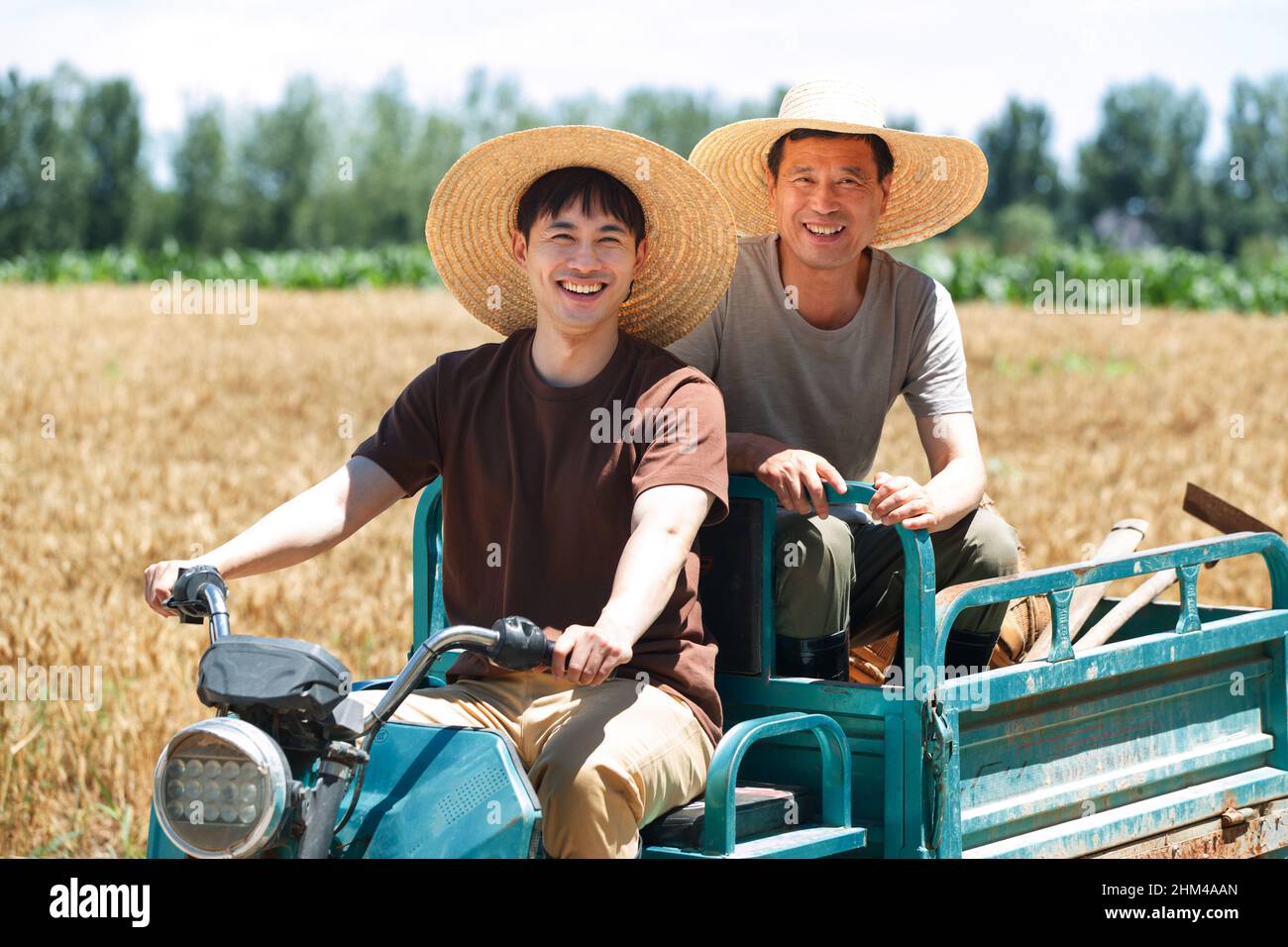 Driving tricycle farmers Stock Photo - Alamy