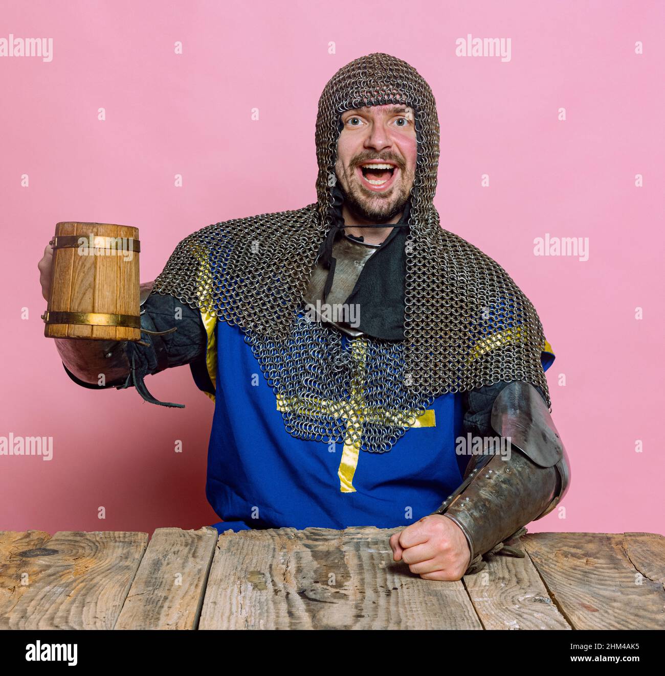 Portrait of excited man, medieval warrior, knight in special protection ...